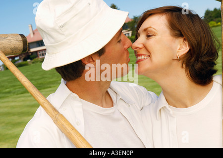 Couple nuzzling each other outdoors Stock Photo: 66366058 - Alamy