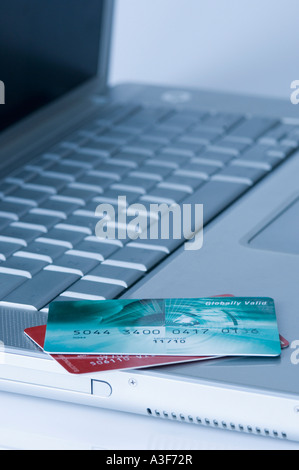 Credit cards on laptop, close up Stock Photo - Alamy