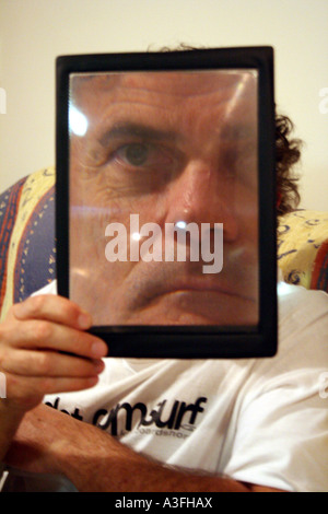 MALE WITH DISTORTED FACE BEHIND MAGNIFYING GLASS VERTICAL BAPDA8897 ...