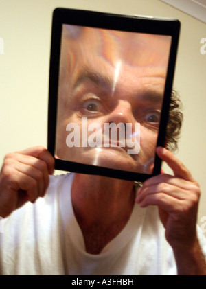 MALE WITH DISTORTED FACE BEHIND MAGNIFYING GLASS VERTICAL BAPDA8897 ...