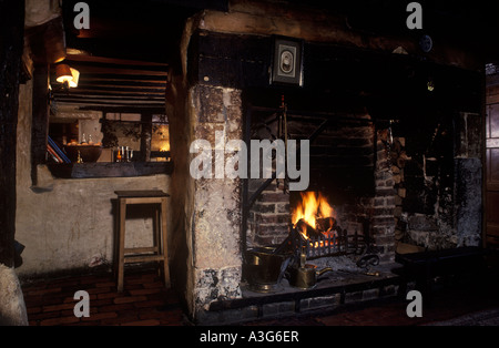 English pub bar with real log fire Stock Photo - Alamy