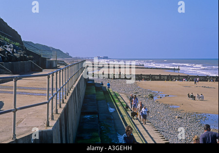 Looking along the sea defences towards The Cobb beach in Lyme Regis on ...