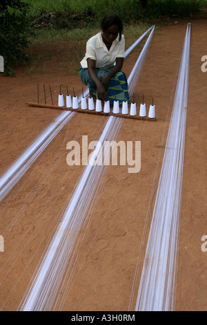 Lady preparing thread for weaving on a loom , Abomey , Benin Stock ...