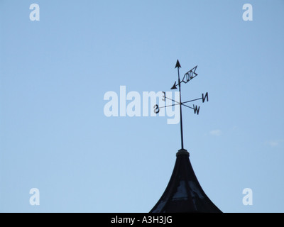 compass weather vain on roof top Stock Photo - Alamy