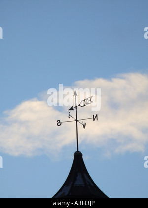 compass weather vain on roof top Stock Photo - Alamy