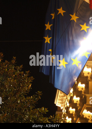 eu flag hanging outside hotel at night Stock Photo - Alamy