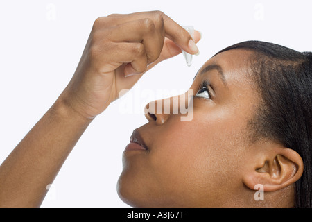 Woman Using Eye Drops Stock Photo Alamy