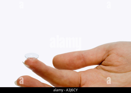 Cropped hand holding contact lens Stock Photo - Alamy