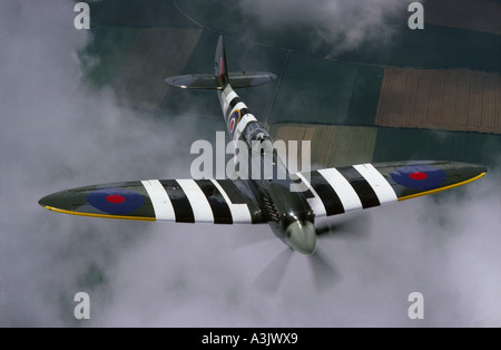 Supermarine Spitfire bearing Invasion stripes in flight Stock Photo - Alamy