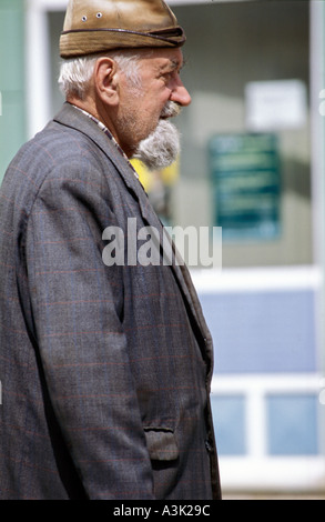 Portrait of poor homeless man with hat outdoors Stock Photo - Alamy