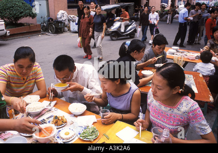 China 2000s. Chinese office workers, a couple eating lunch a meal ...