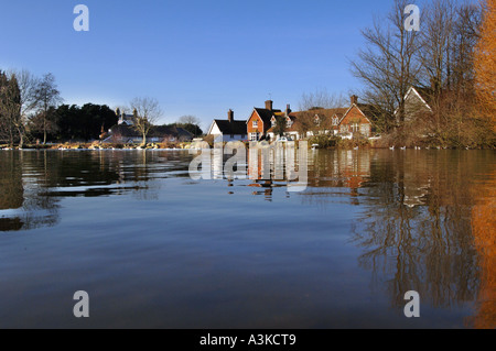 picturesque houses in the village of Falmer East Sussex are reflected ...