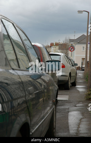 A car parked on a pavement, causing an obstruction for pedestrians ...