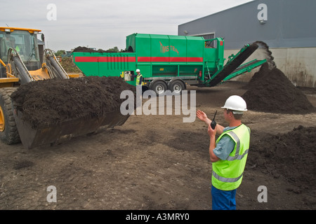 Commercial composting plant operation. Screening compost before storage ...