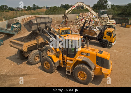 Sorting building construction waste at a skip materials recovery Stock ...