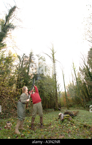 game keeper retrieving birds Stock Photo - Alamy
