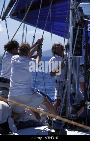 Crew hoisting sails on the yacht Reliance, winner of 1903 America's Cup ...