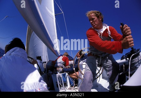 Teamwork onboard a sailing yacht racing in a regatta Stock Photo - Alamy