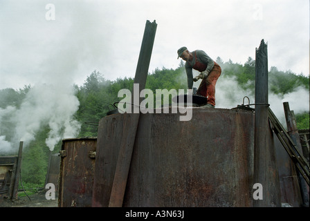 Man working in charcoal furnaces in east Serbia Stock Photo - Alamy