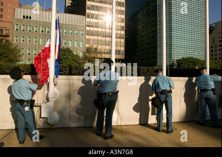 United Nations security guards raise the member states flags in front ...