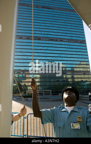 United Nations security guards raise the member states flags in front ...