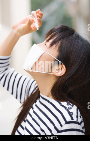 Asian woman applying eye mask patches for skincare beauty treatment at ...