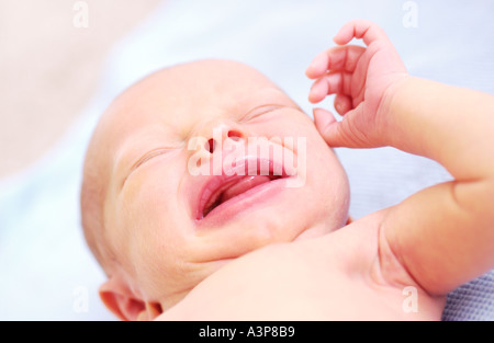 small baby crying in crib Stock Photo - Alamy