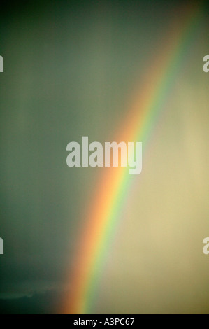 RAINBOW IN STORMY SKY WITH SLANTING RAIN Stock Photo - Alamy