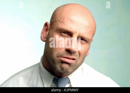 Man with a reluctant look on his face Stock Photo - Alamy