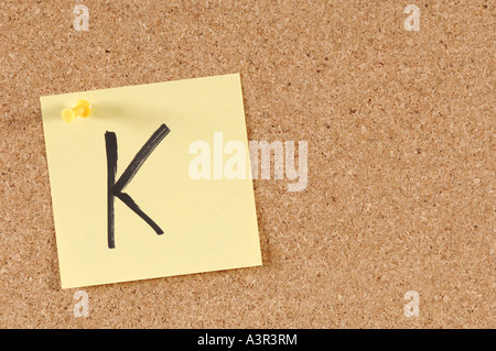 Message cork board with alphabet letter Stock Photo - Alamy