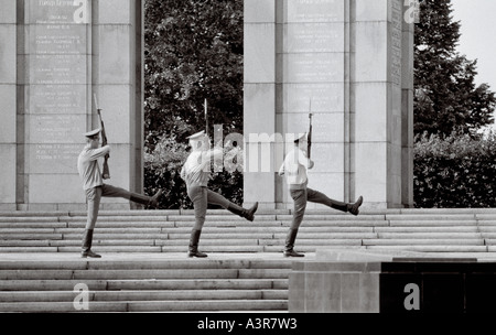 Soldiers goose stepping at the war memorial monument in Victory Square ...