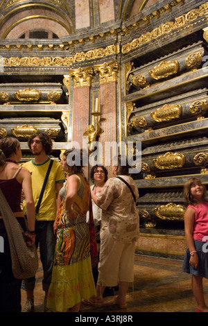 El Escorial, Spain. Tourist family asleep on stone bench Stock Photo ...