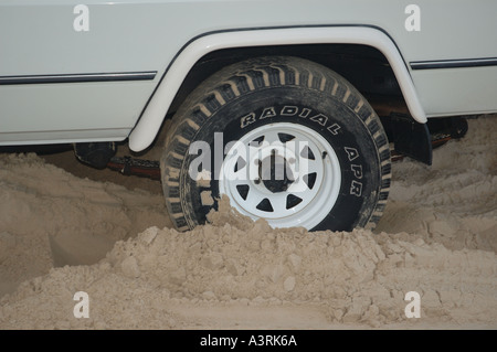 A car is bogged down in the sand Stock Photo - Alamy
