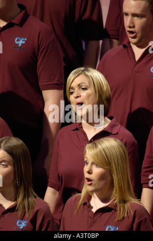 Mixed group of people, women and men communicates shouting loud holding ...