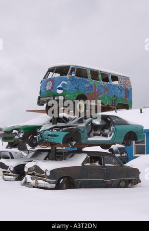 A Volkswagen bus tops a stack of cars at a junkyard near Marquette ...