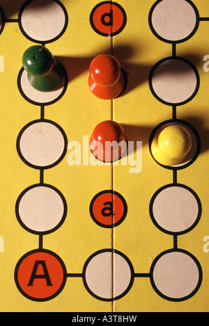 ludo game close up with pawns dices and blue background, soft focus ...