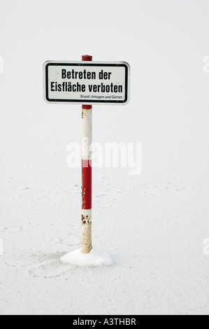 Red warning sign in frozen lake/pond Danger Unsafe Ice sign potential ...