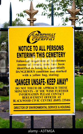 Unsafe headstones with yellow warning notices at a cemetery in Risca ...