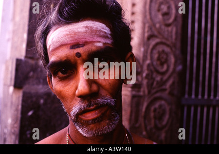 Tika or tilaka mark on the forehead of a currency dealer in India ...