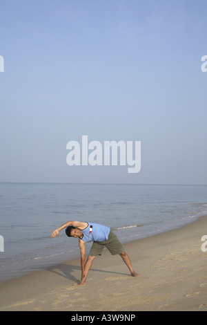 young asian man exercising in gym using fitness straps Stock Photo - Alamy