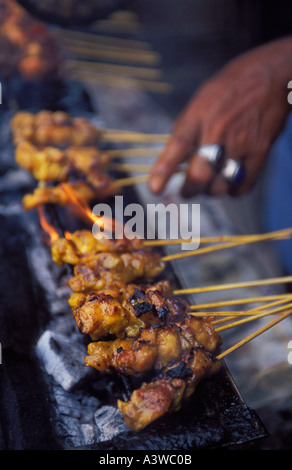 Cooked barbequed exotic street food snake in a market stall in Phnom ...