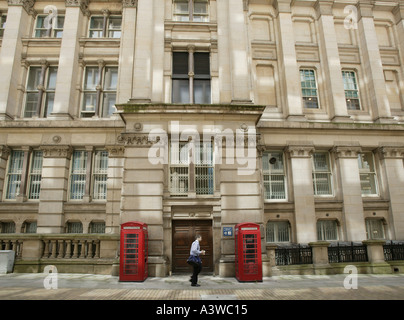 Two red telephone boxes along side the Victorian Council House in ...
