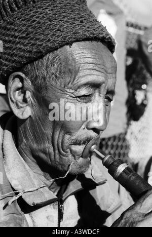 Ladakhi man playing traditional music instrument Surma trumpet Ladakh ...