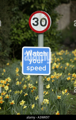 Speed restriction signs with added warnings in a Warwickshire village ...