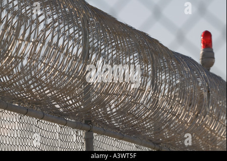 Secured with razor wire on top of the iron fence Stock Photo - Alamy