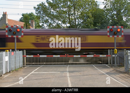 red train on train tracks Stock Photo - Alamy