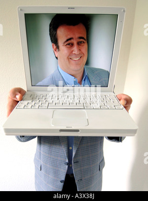 Man, laptop screen and smile in studio with mockup space, thinking and ...