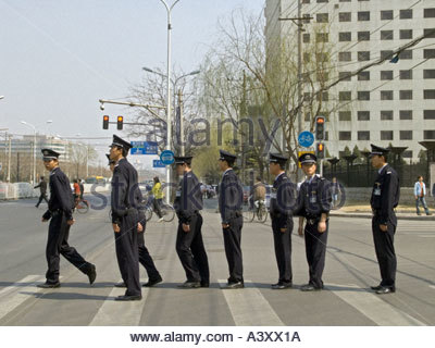 Chinese Traffic Police wearing uniform at the street standing and Stock ...
