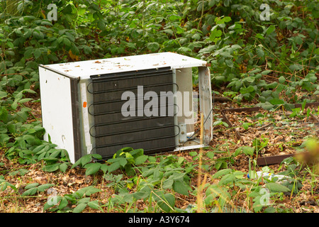 Fly Tipping Disposed Refrigerator in woodland Stock Photo - Alamy