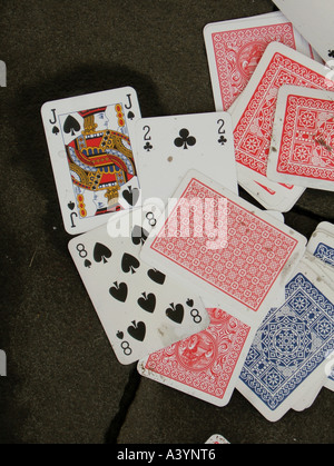 cards discarded on wet pavement Stock Photo - Alamy